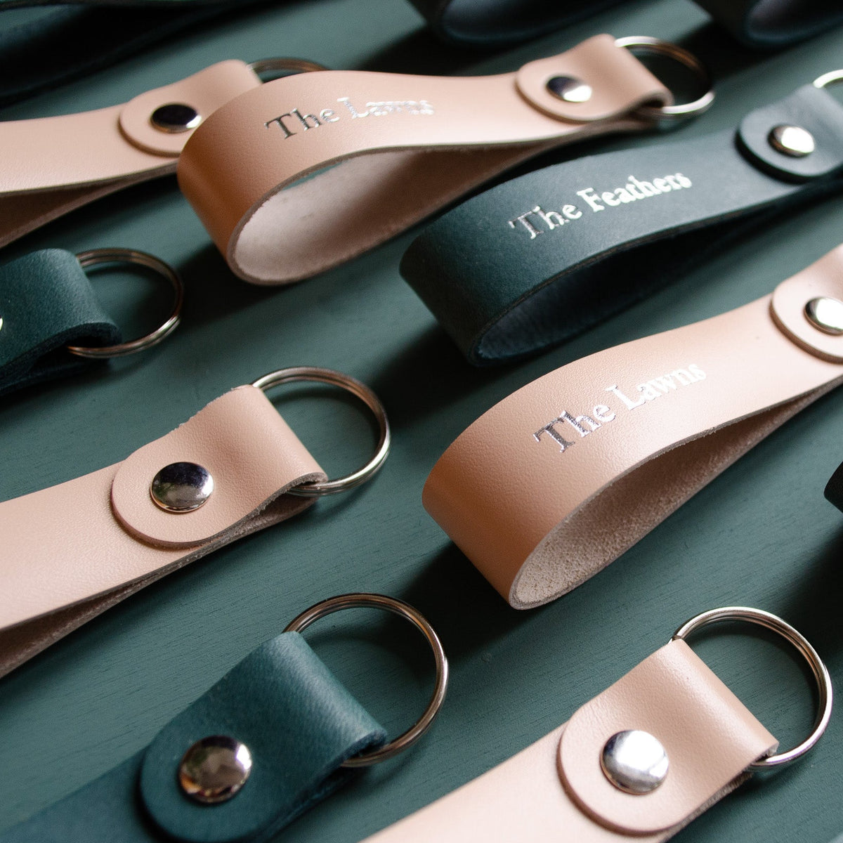 Custom leather key rings manufactured in England for hotels – Studio Lowen